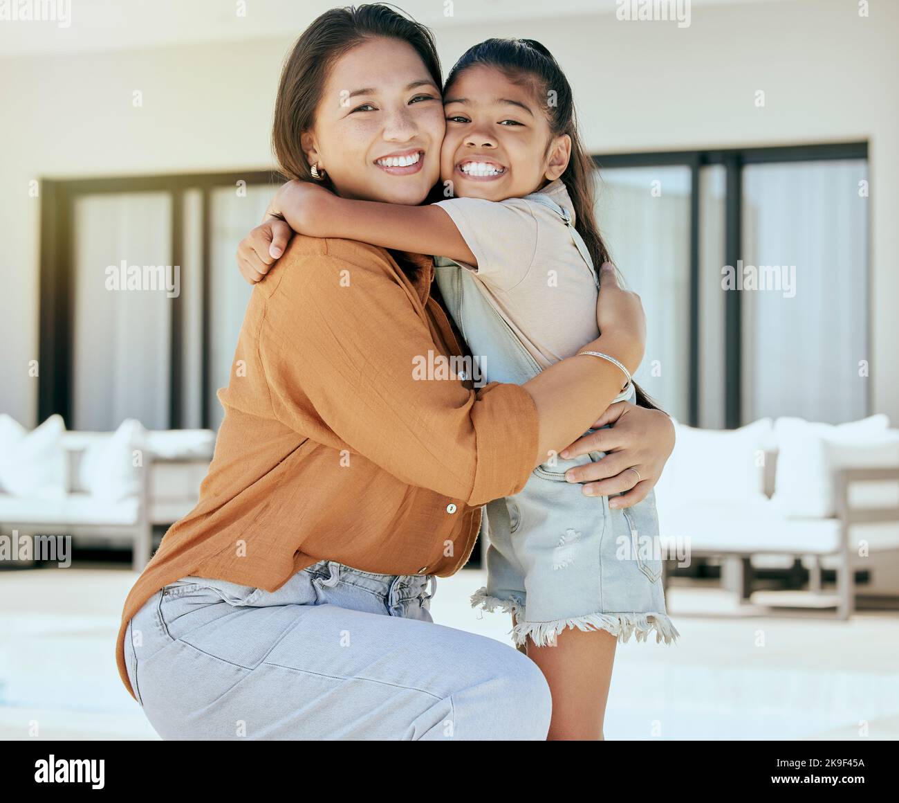 Mother with daughter hug, love and smile in family portrait, bonding ...