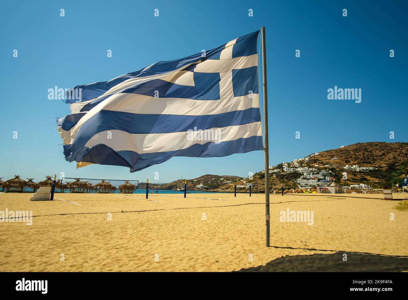 View of a beautiful big national greek flag blowing in the wind at the ...