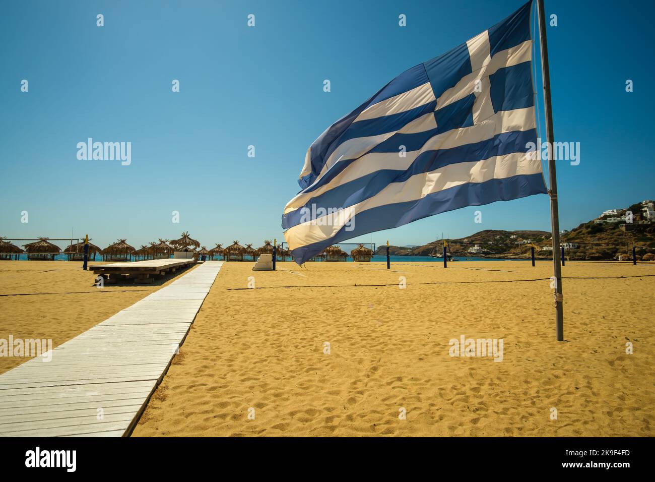 View of a beautiful big national greek flag blowing in the wind at the ...