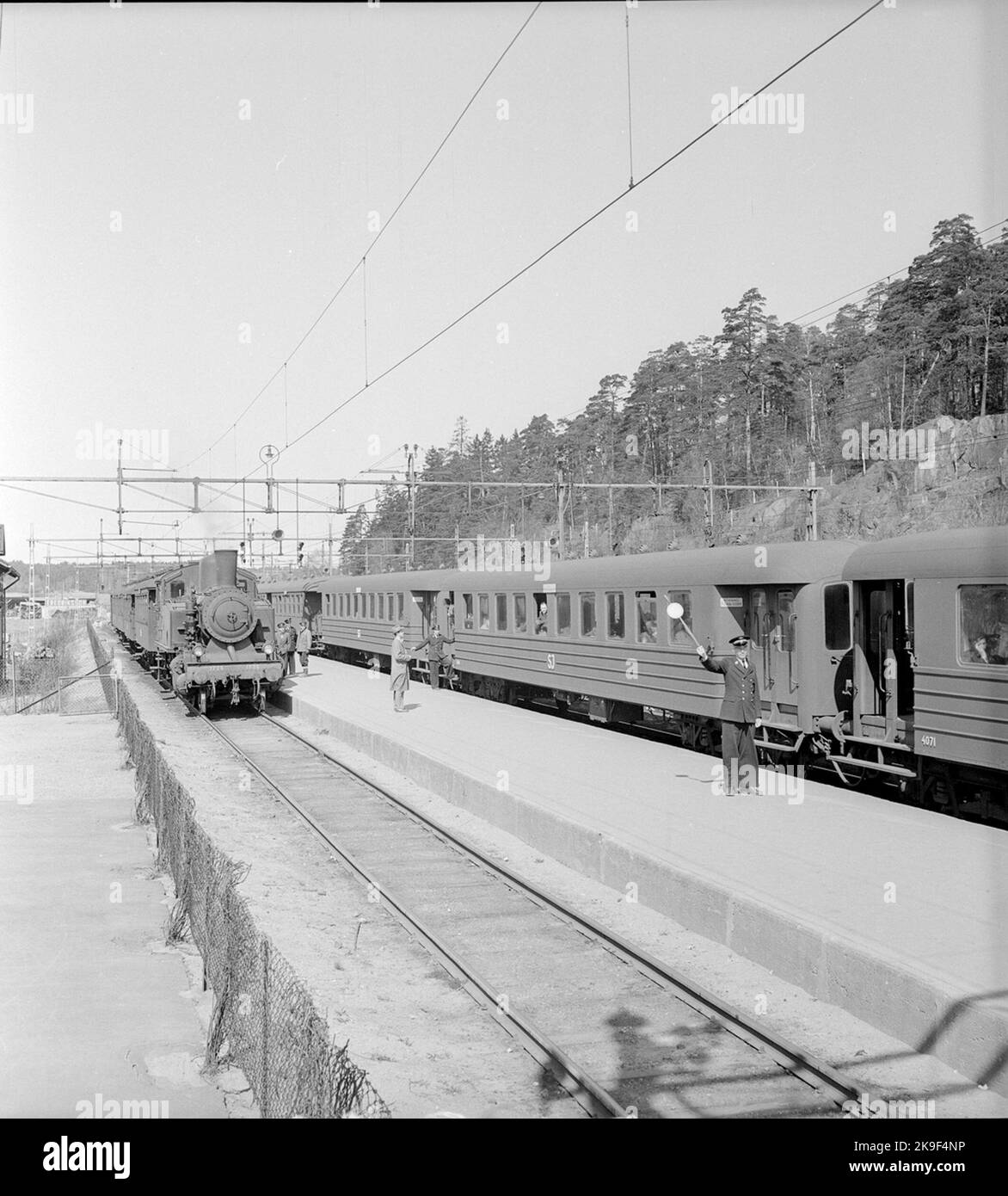 Signal for departure. State railways, SJ B6G wagons. The steam ...