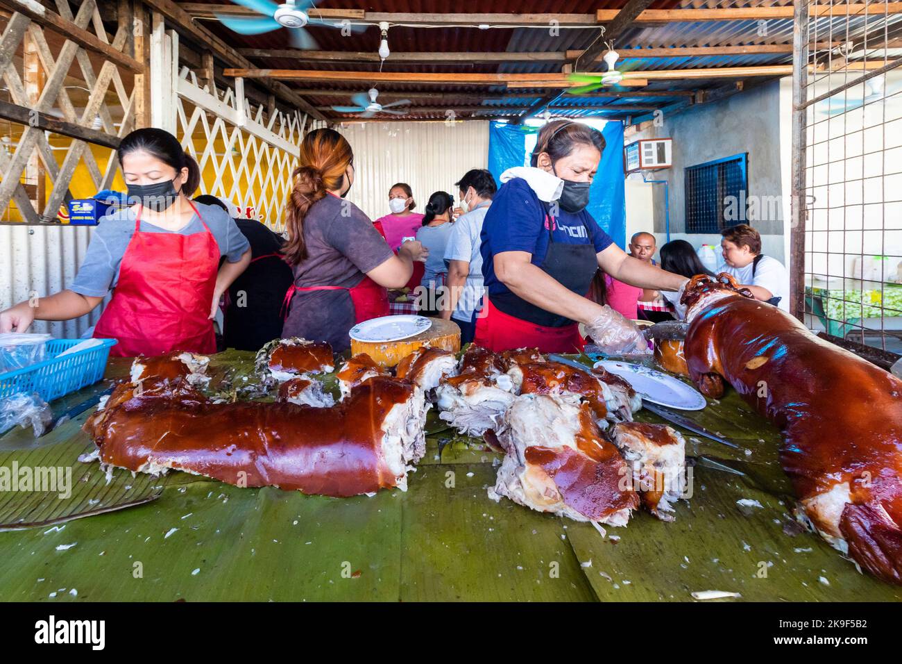 Popular filipino lechon or roast pig sold at a Sunday market in Cebu ...