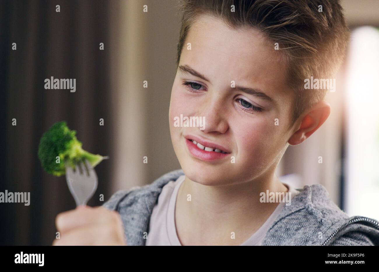 Why cant vegetables taste like candy. a young boy refusing to eat his ...