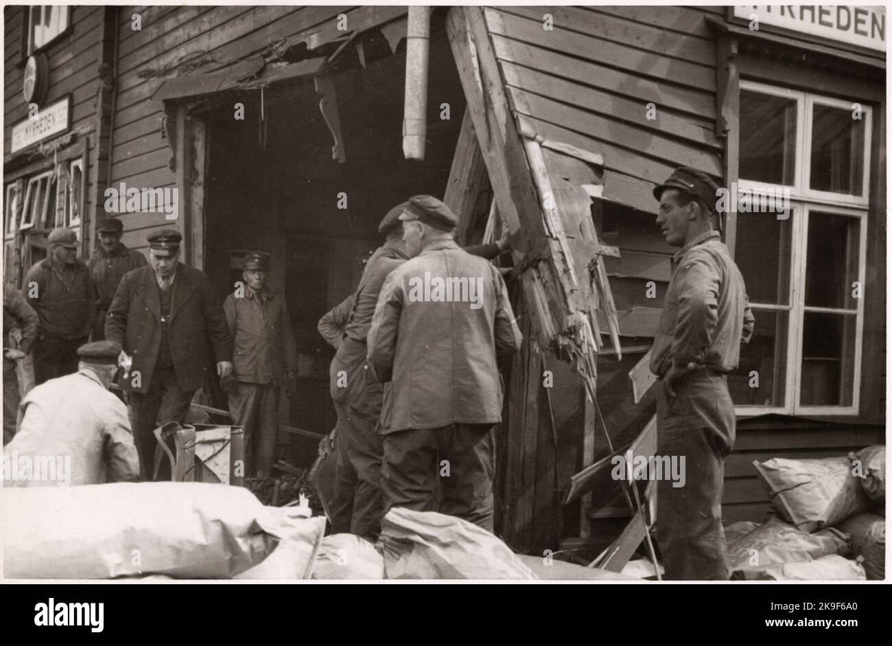 Personnel at damaged station houses after derailment Stock Photo - Alamy