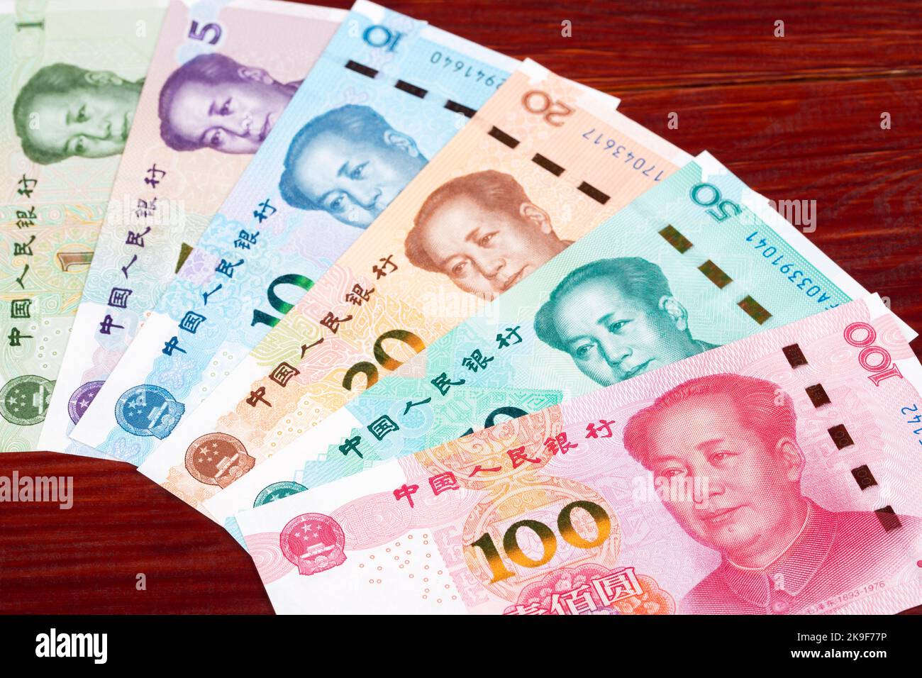 Chinese money - Yuan a business background Stock Photo - Alamy
