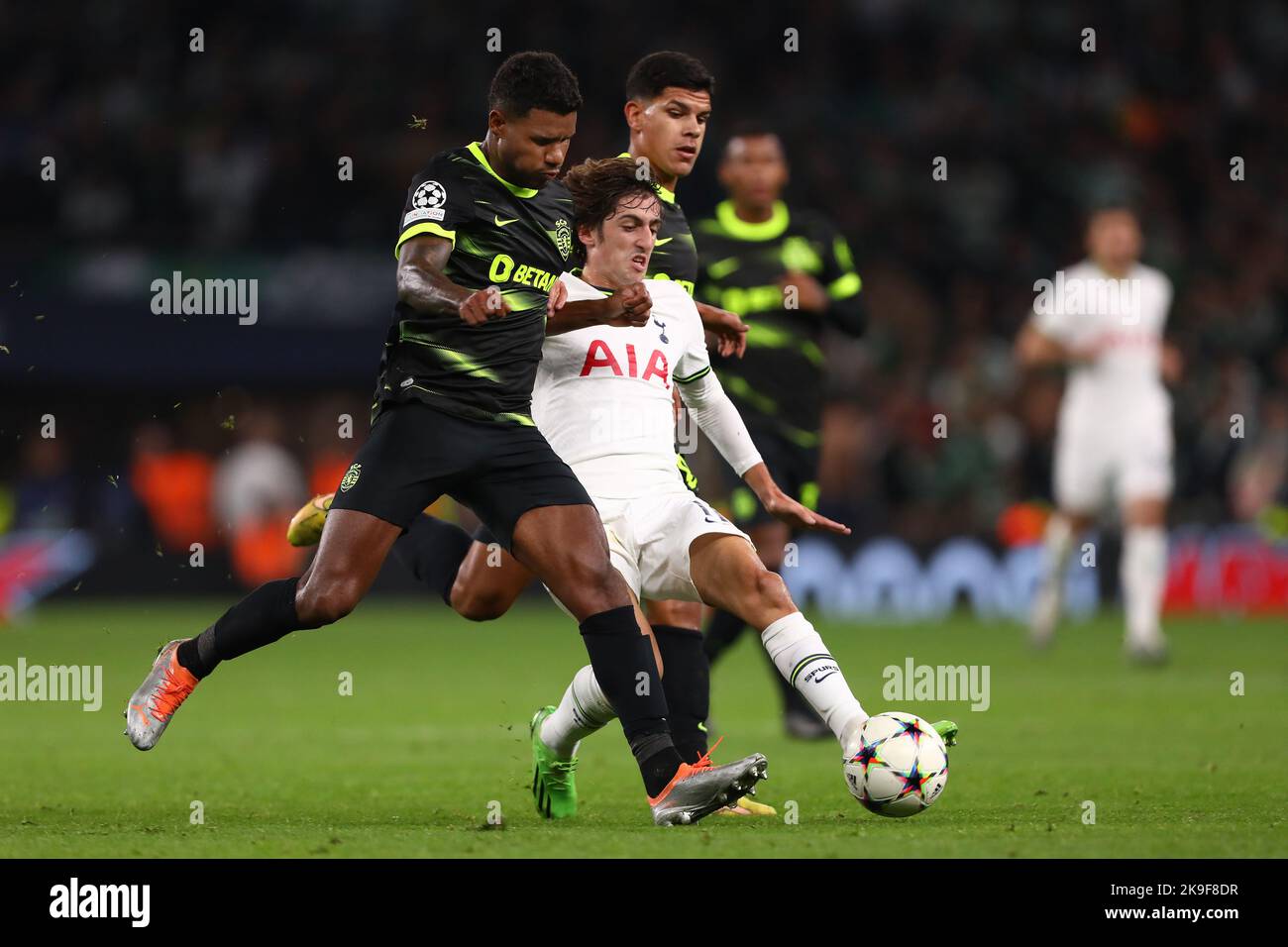 Bryan Gil of Tottenham Hotspur in action with Matheus Reis and Mateus ...