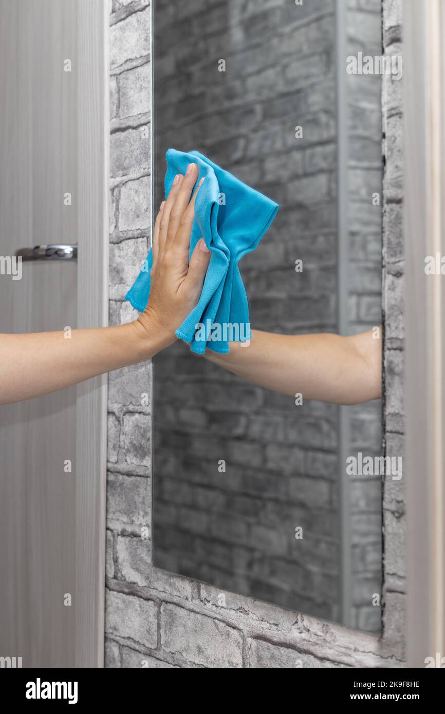 Woman wiping mirror rag hi-res stock photography and images - Alamy