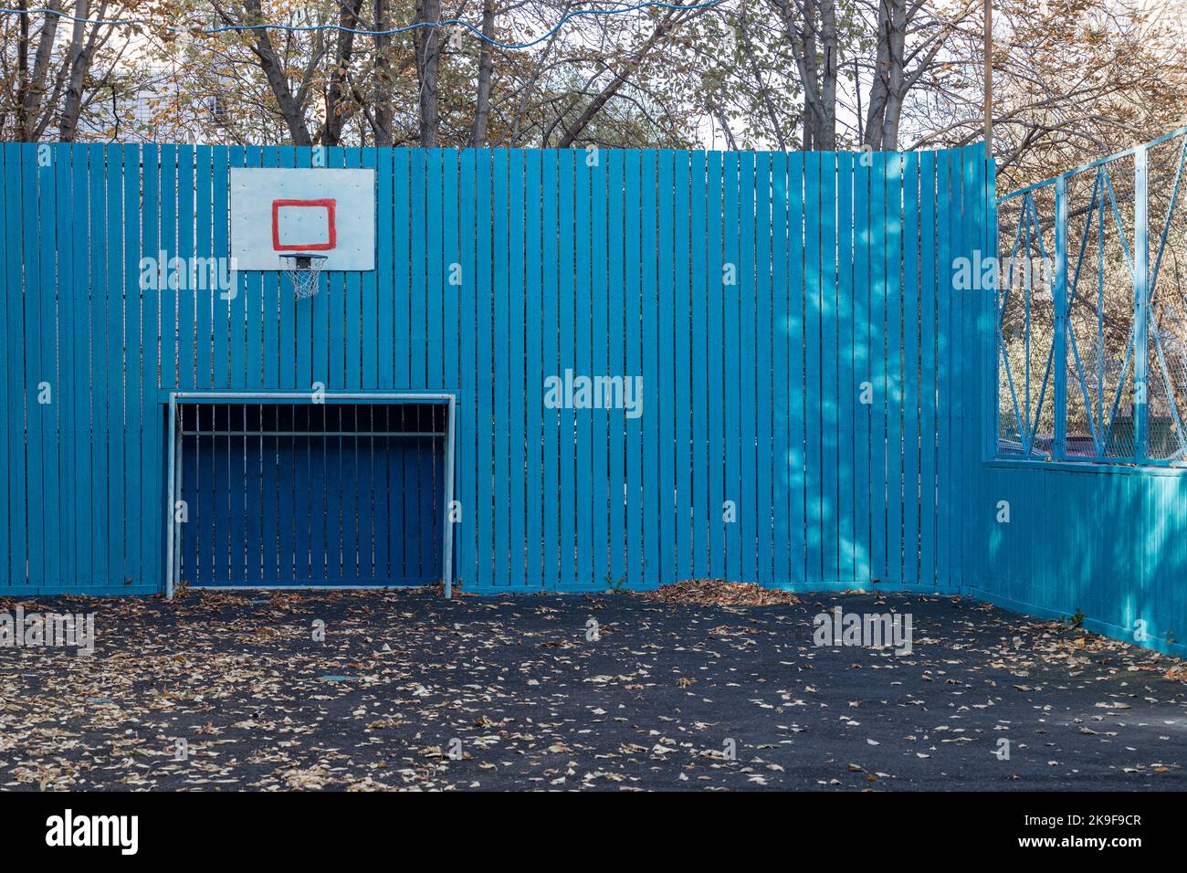 city football field with goal and basketball hoop. city sports ground ...
