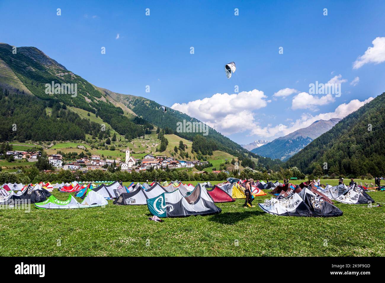 Latsch, Italy - August 1, 2009: people enjoy windsurfing at lake Levico ...