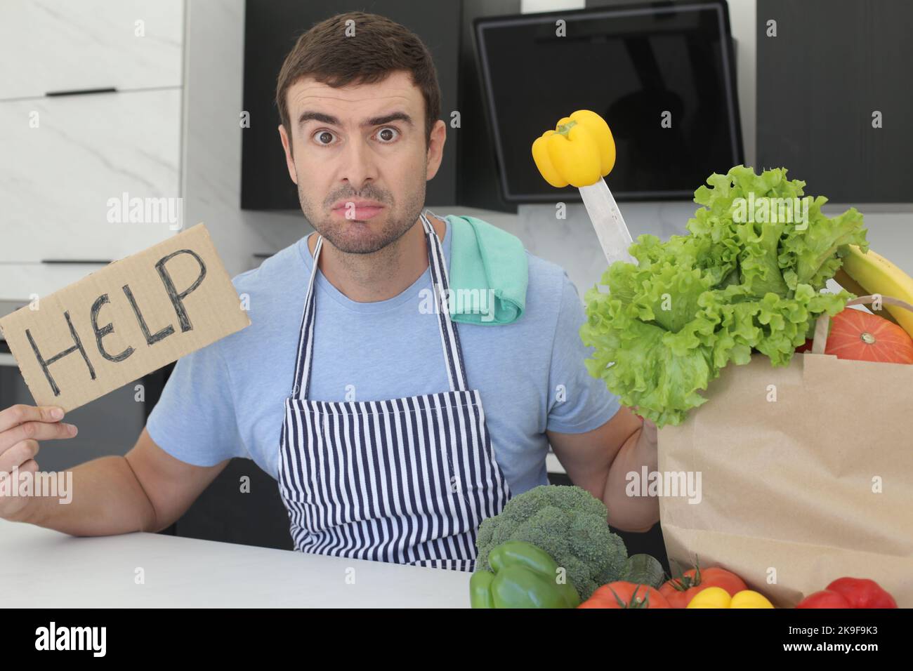 Confused man asking for help in the kitchen Stock Photo - Alamy
