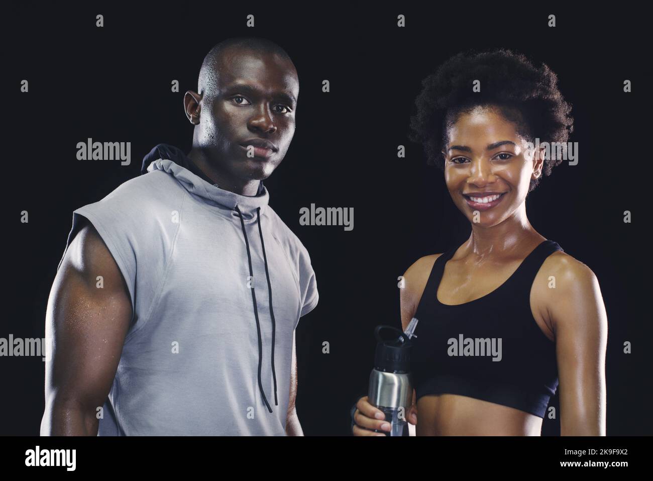 We are the real deal. Studio shot of two young athletes posing together ...