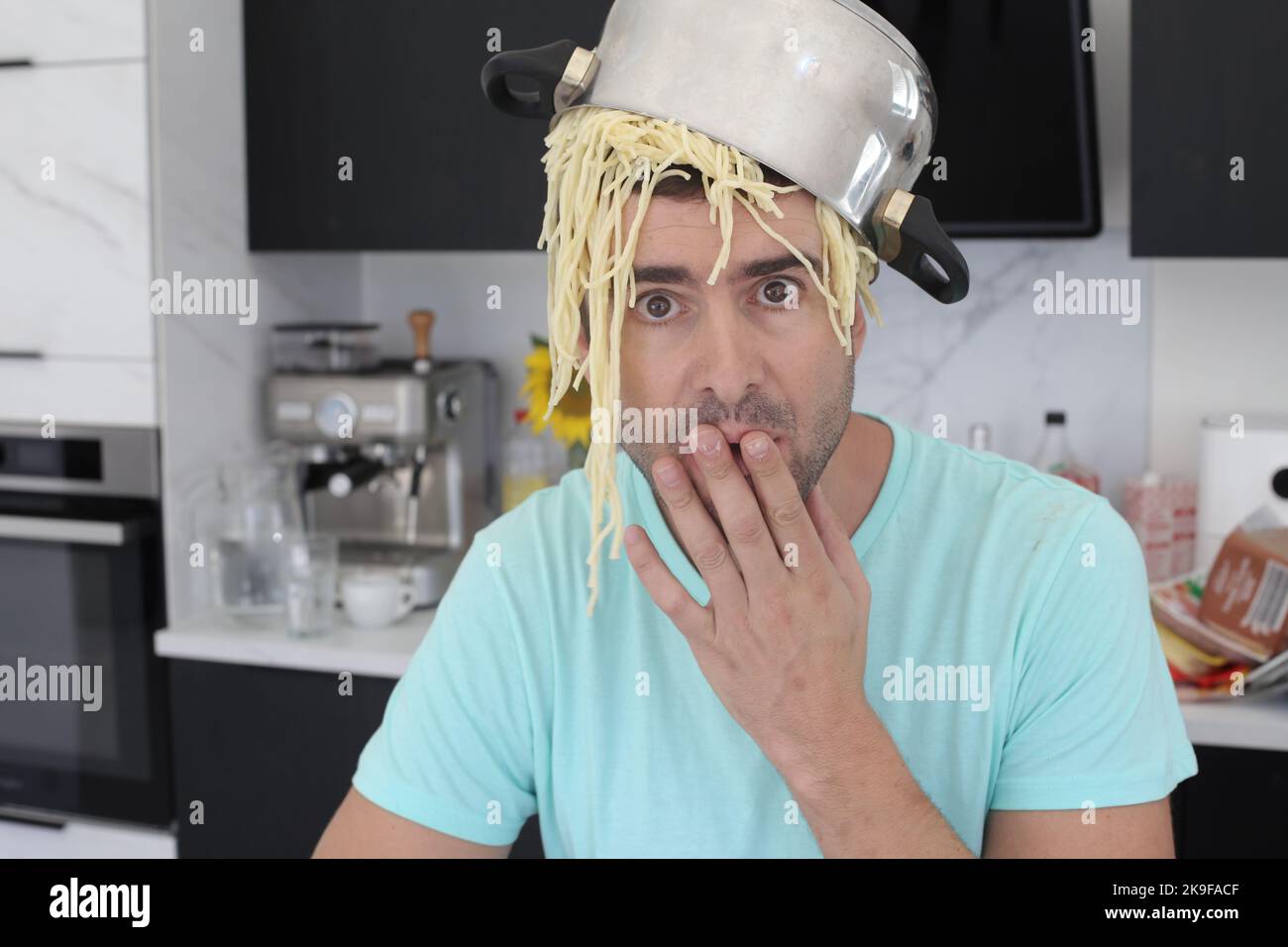 Chaotic chef trying to make some pasta Stock Photo - Alamy
