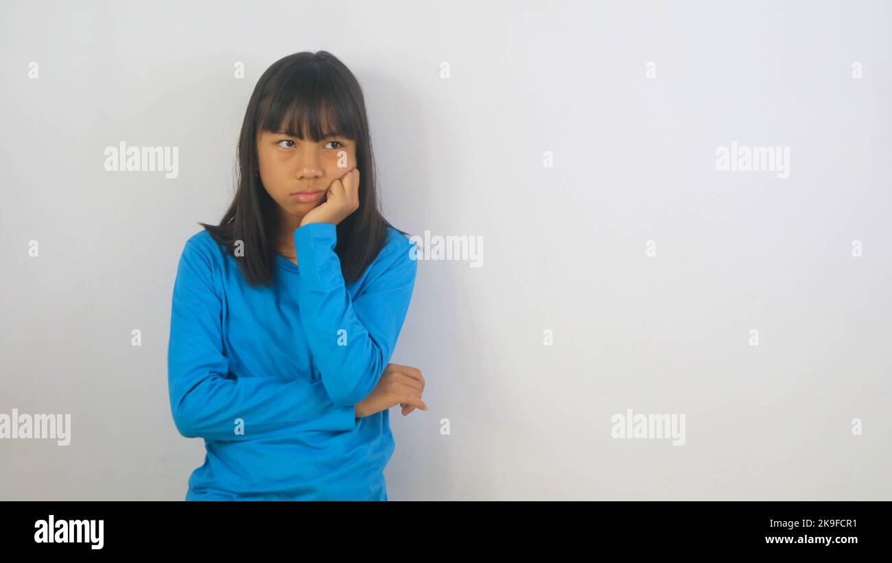 a little girl mixed european asia in blue shirt isolated on white ...