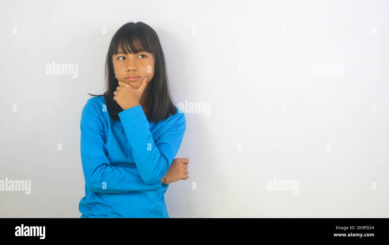 a little girl mixed european asia in blue shirt isolated on white ...