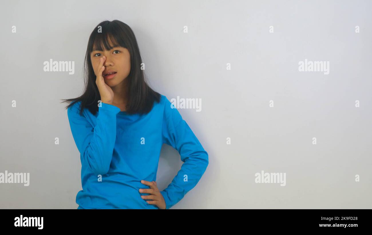 a little girl mixed european asia in blue shirt isolated on white ...