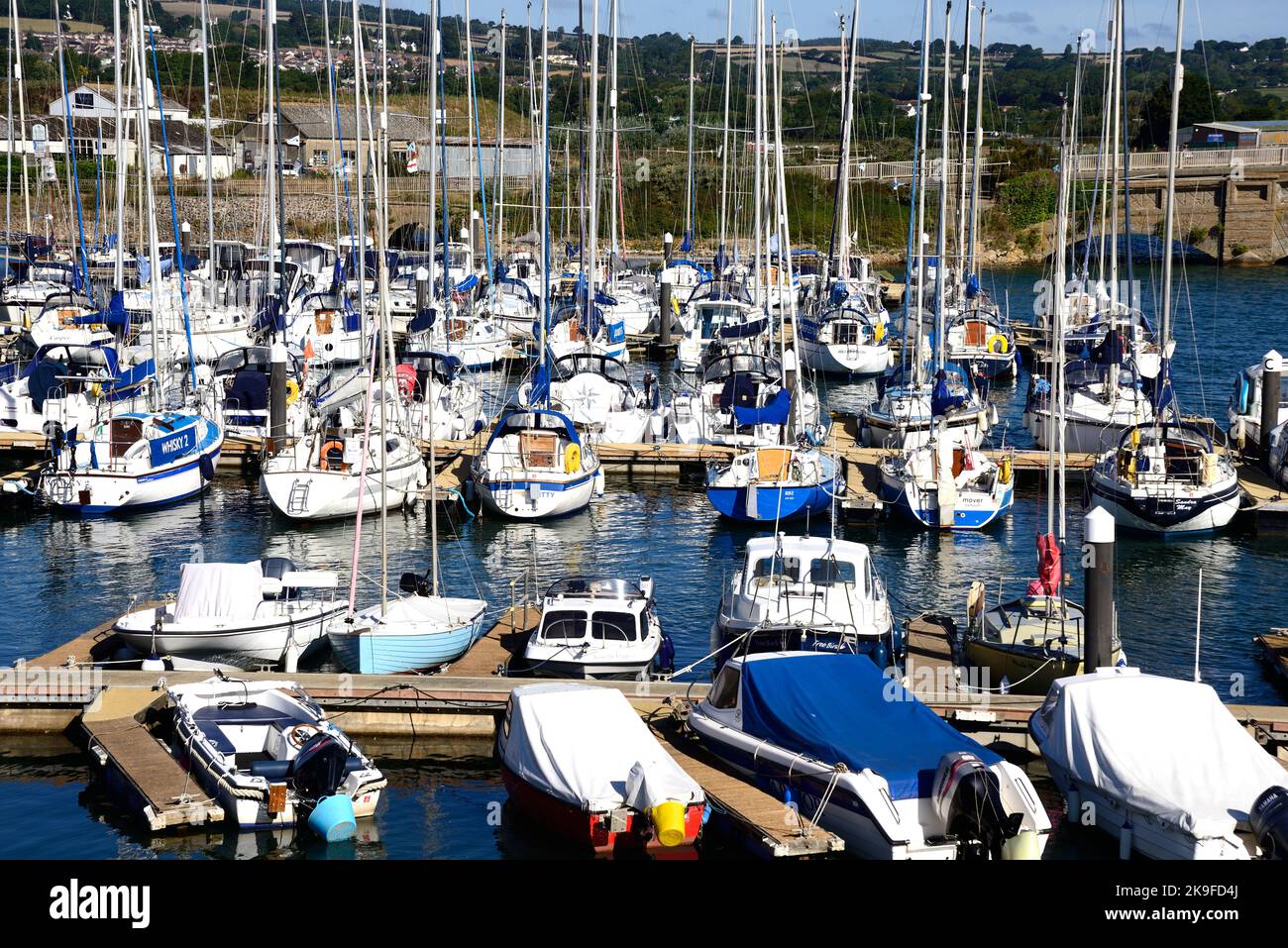 Yachts and boats moored along the River Axe with views across the Devon ...