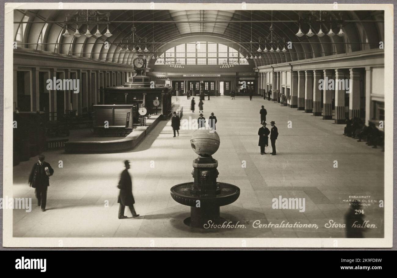 Interior of station house and waiting room with travelers in the ...