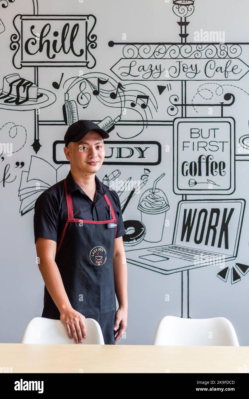 A Filipino barista at a local cafe in Cebu City, Philippines Stock ...