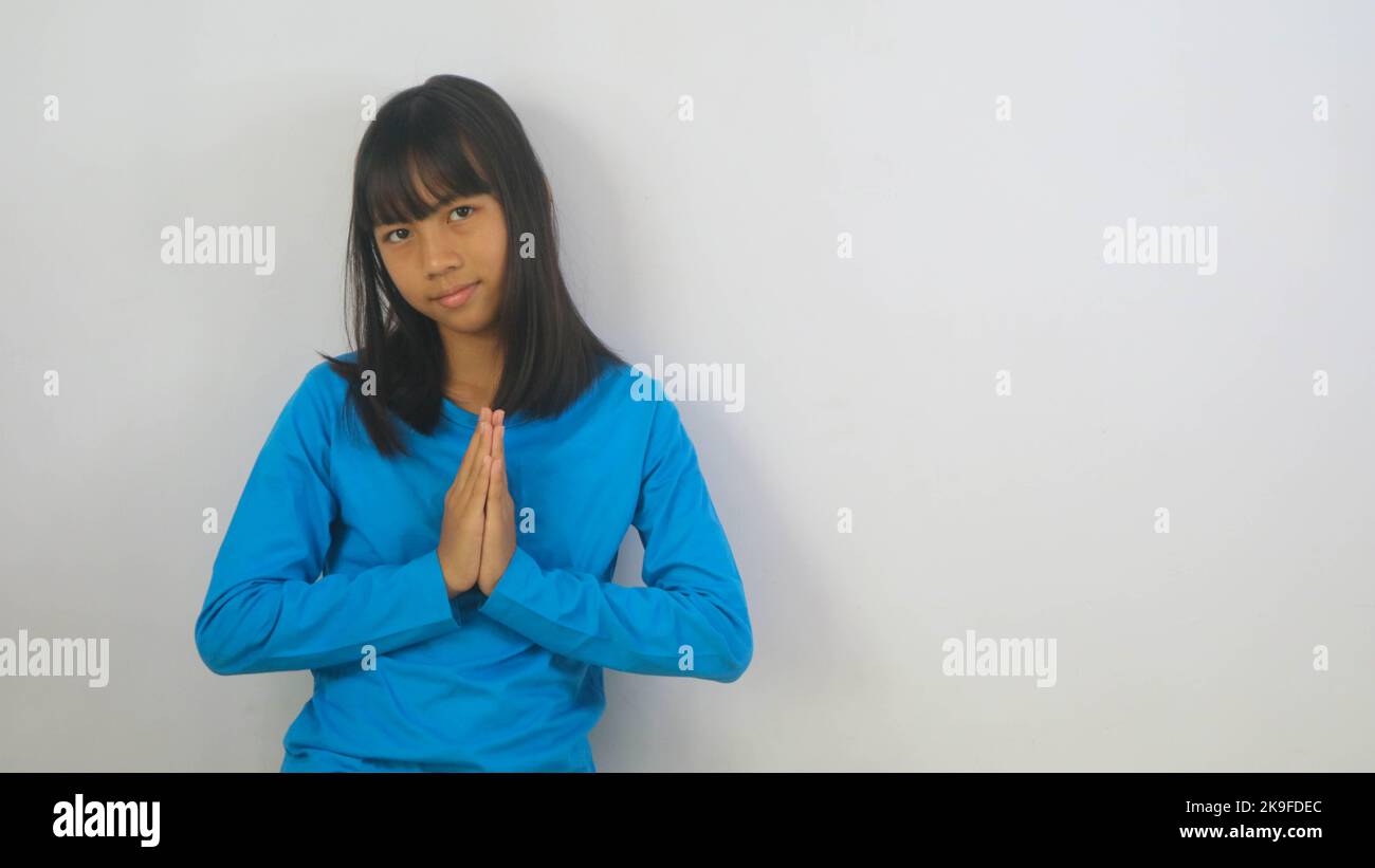 a little girl mixed european asia in blue shirt isolated on white ...