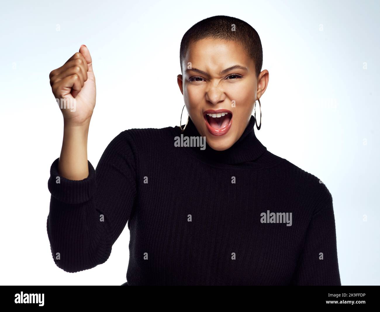 Yes we can. Studio shot of an attractive young woman posing with her ...