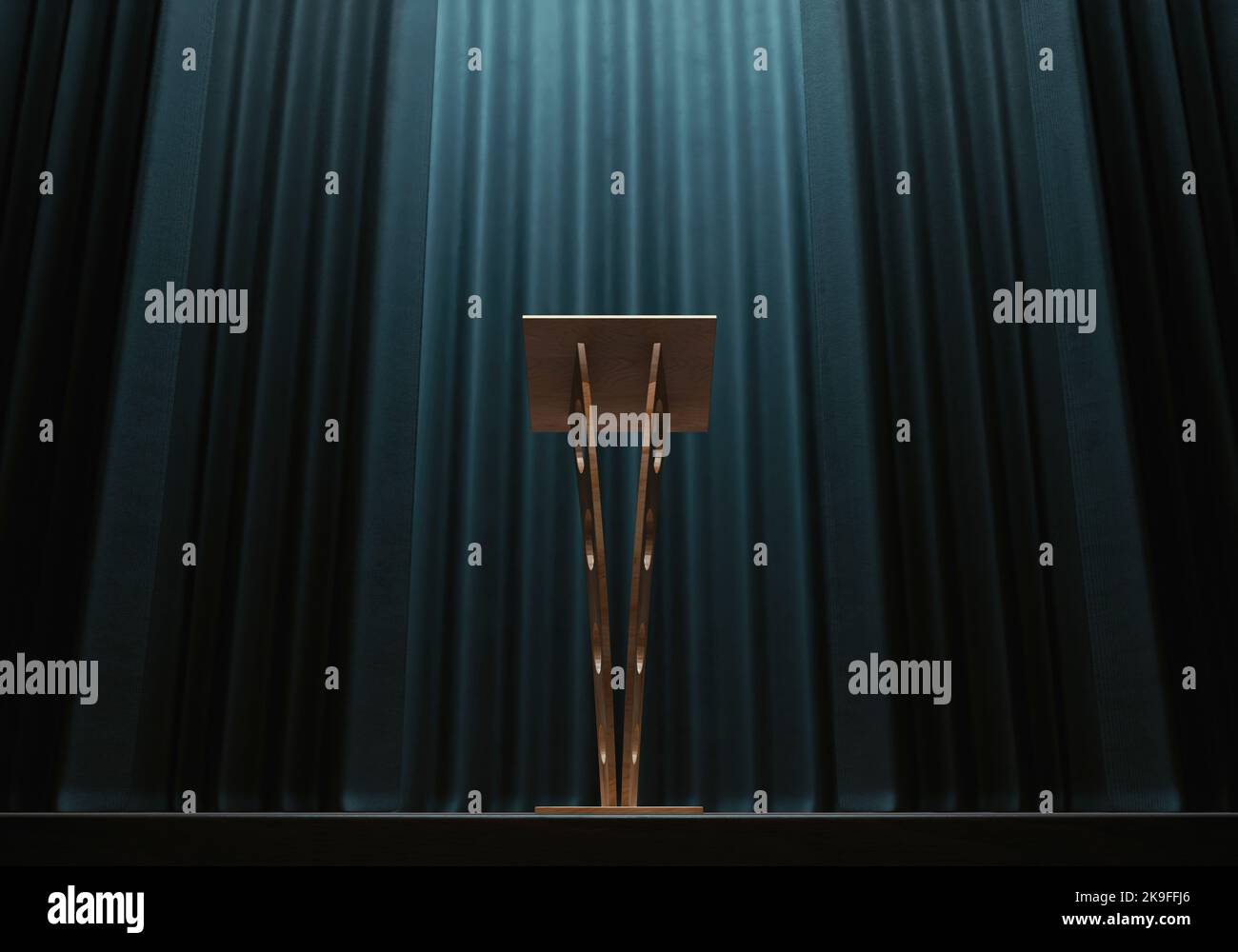 A wooden speech podium with small microphones on a dark curtained stage ...