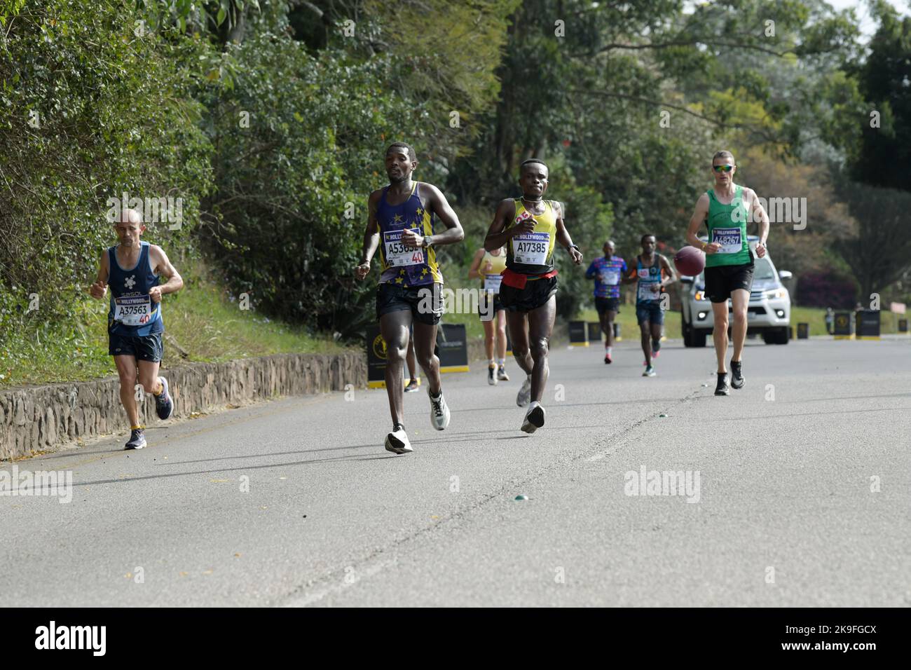 Running sport, group of men compete in 95th Comrades Marathon 2022, long distance athletics race ...