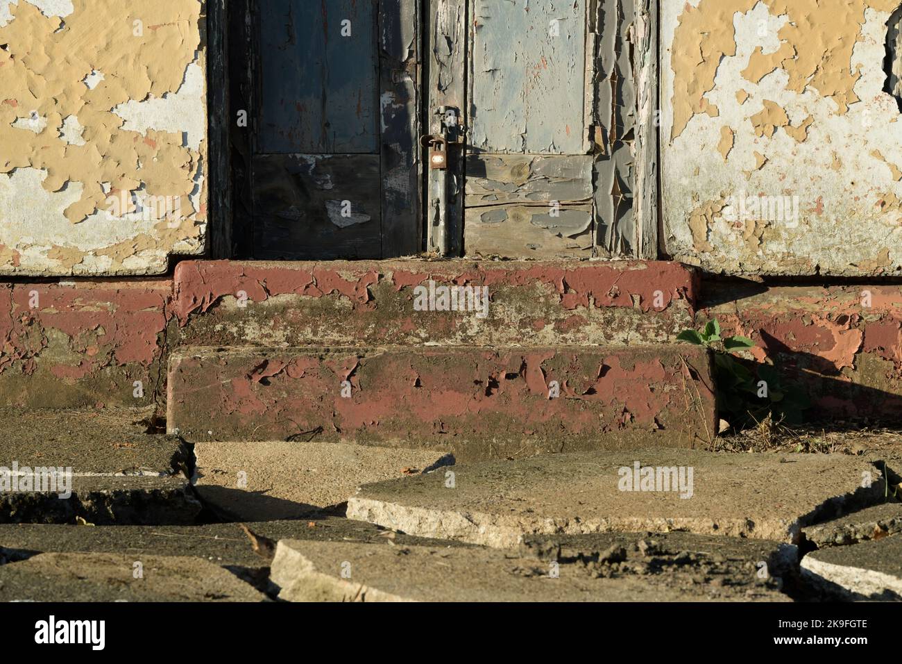 Beautiful weathering, door, lock, steps, building in decay, rundown ...