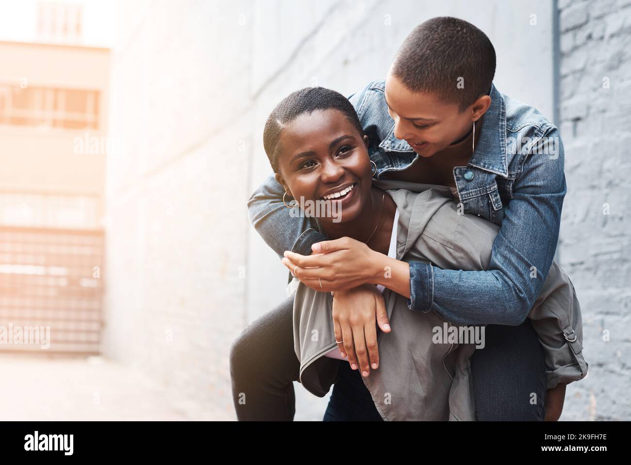 Love is never too big of a load to carry. a young woman carrying ...