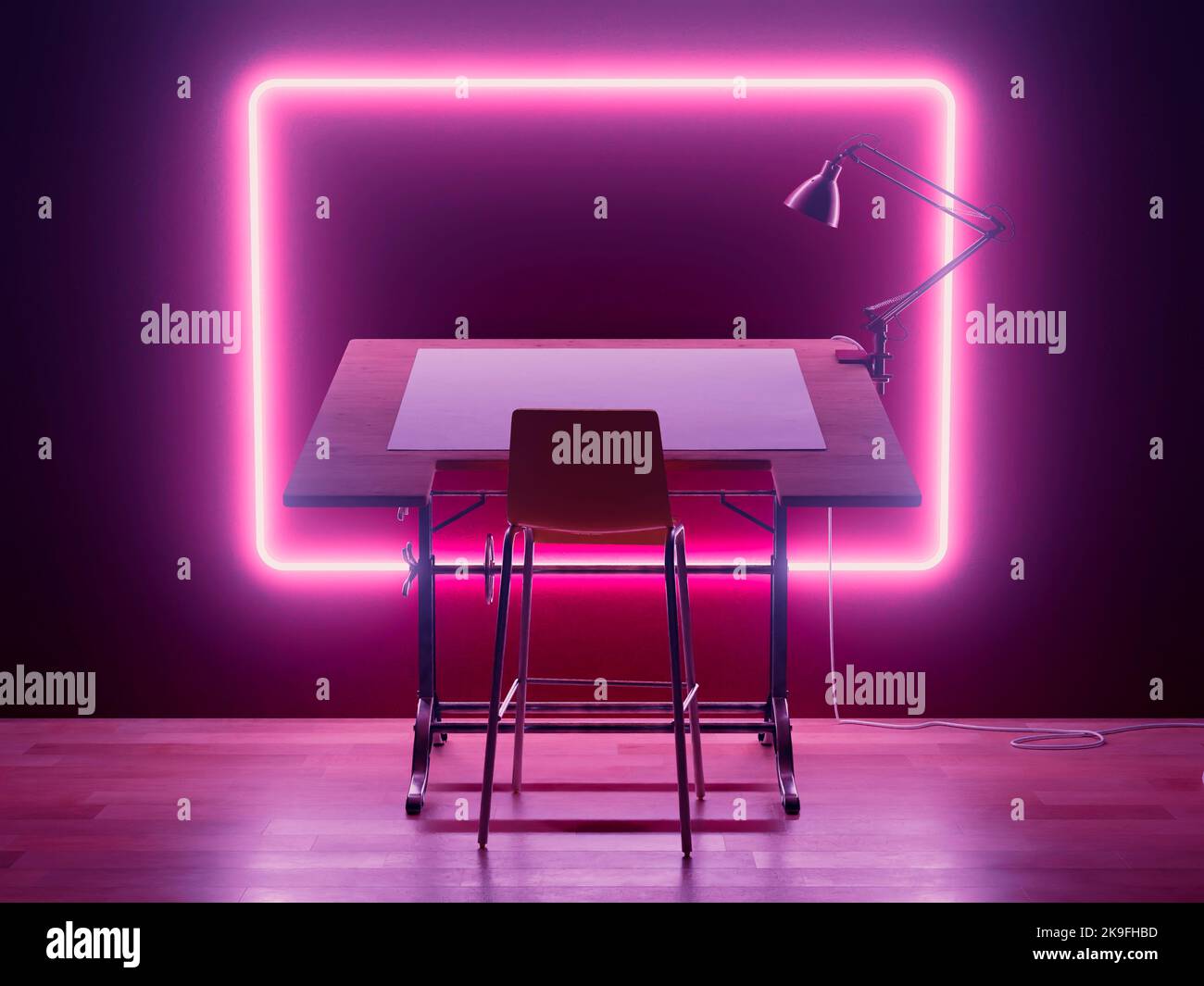 A vintage draftsmans desk workstation in the dark framed by an ...