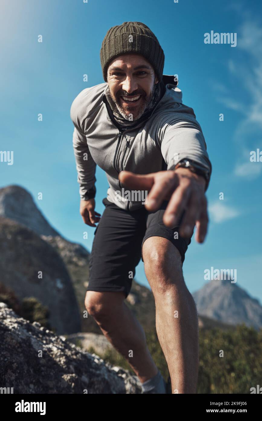 Take my hand and lets journey beyond together. Low angled portrait of a ...