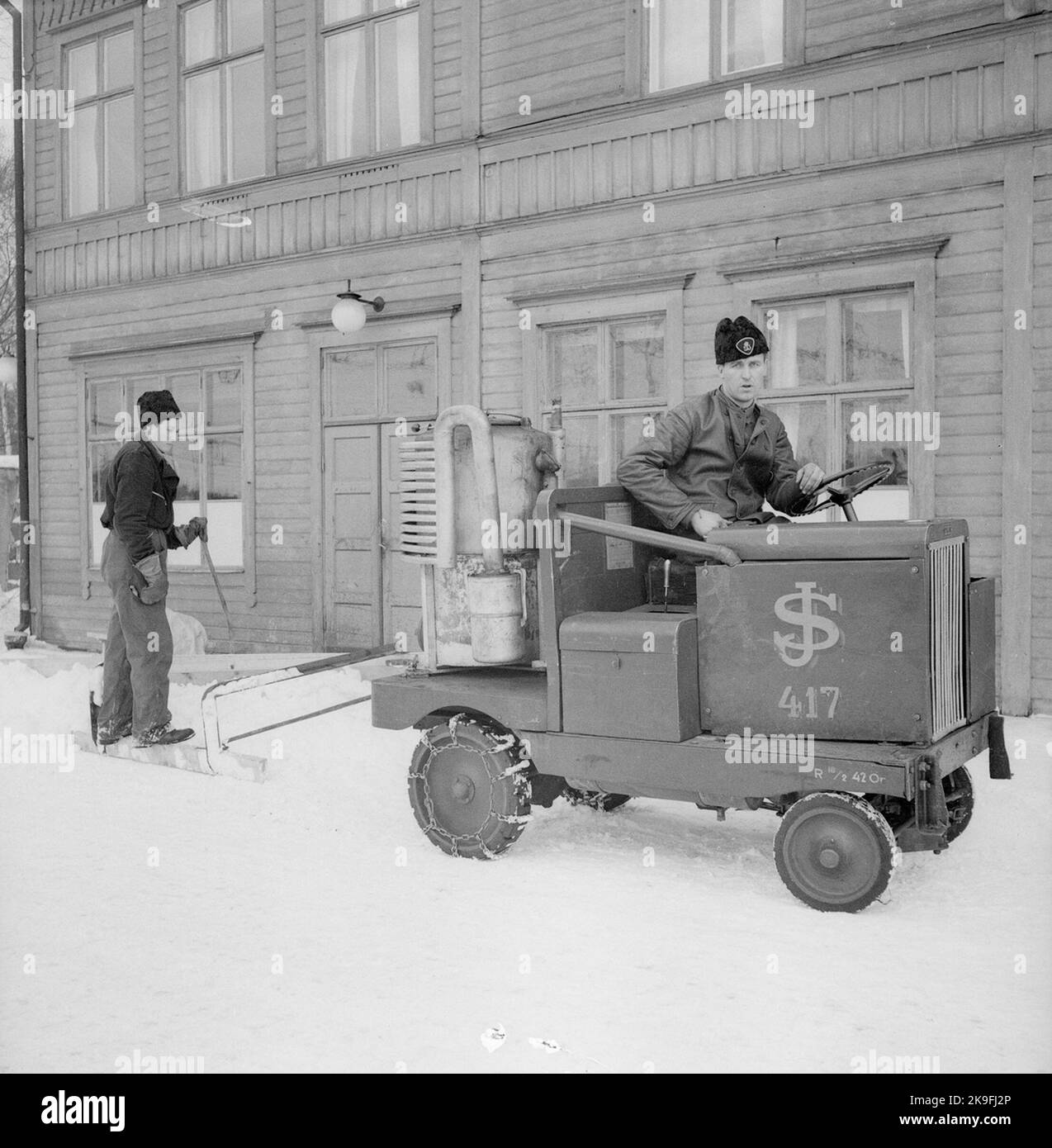 The State Railways, SJ 417, platform tractor with snow plow, in work at ...