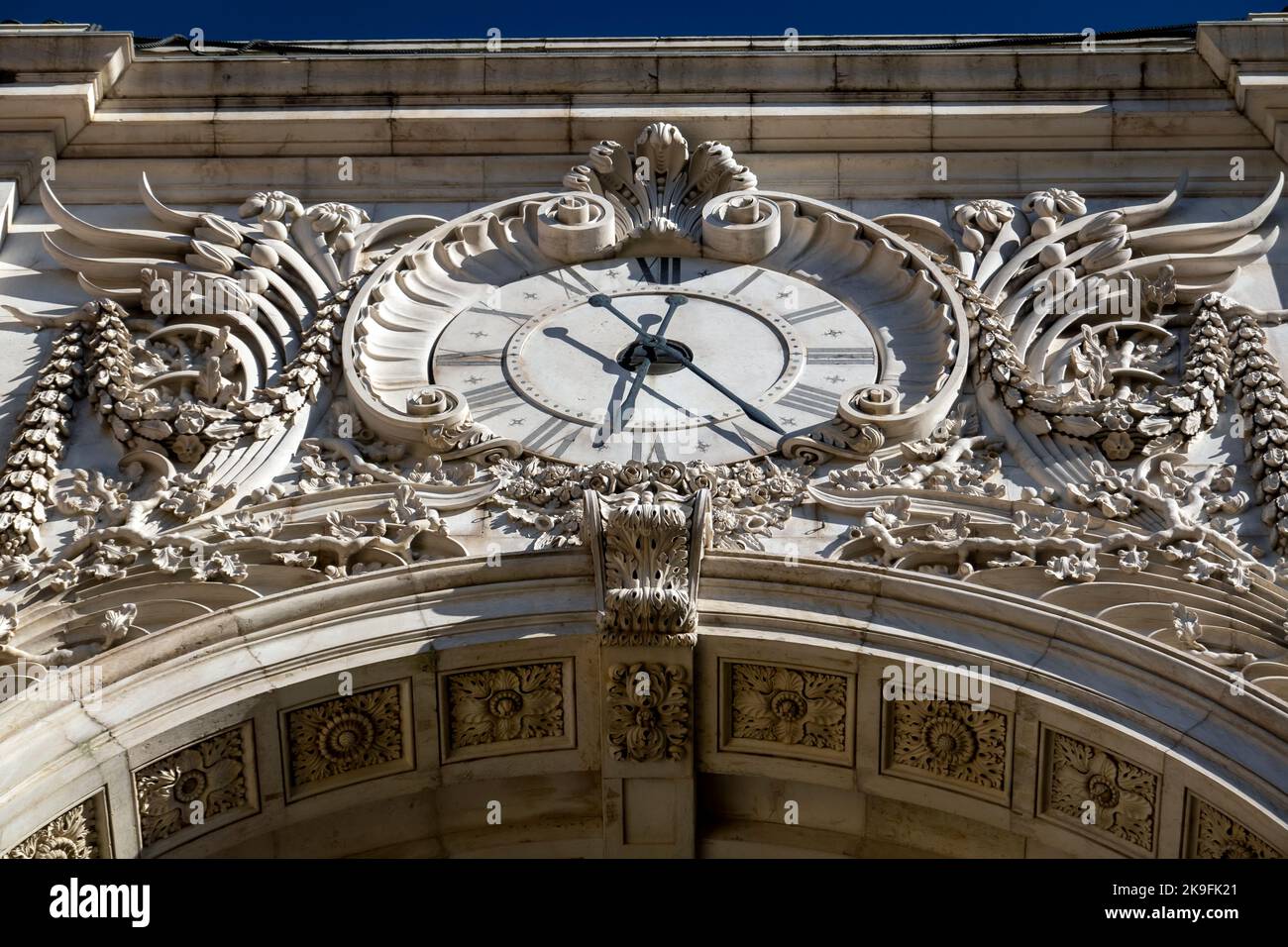 View of clock detail from the famous historical arc of Street Augusta ...