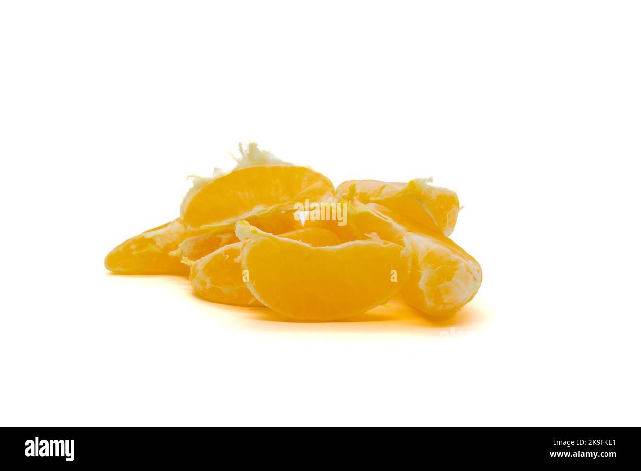 Yellow slices of satsuma orange (Citrus unshiu) isolated on white ...