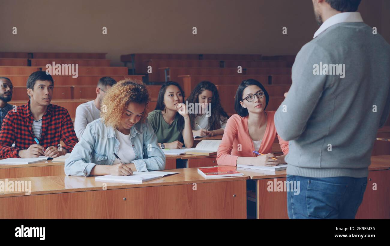 Emotional tutor is speaking to adult students explaining new ...