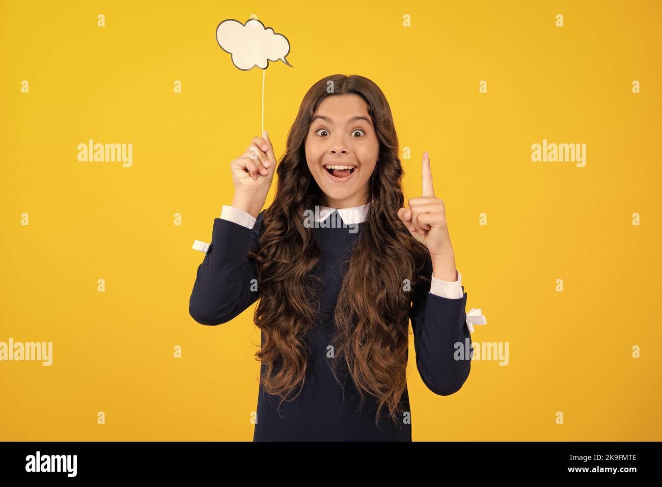 Excited face. Teen girl holding clouds empty space, thinking bubble ...