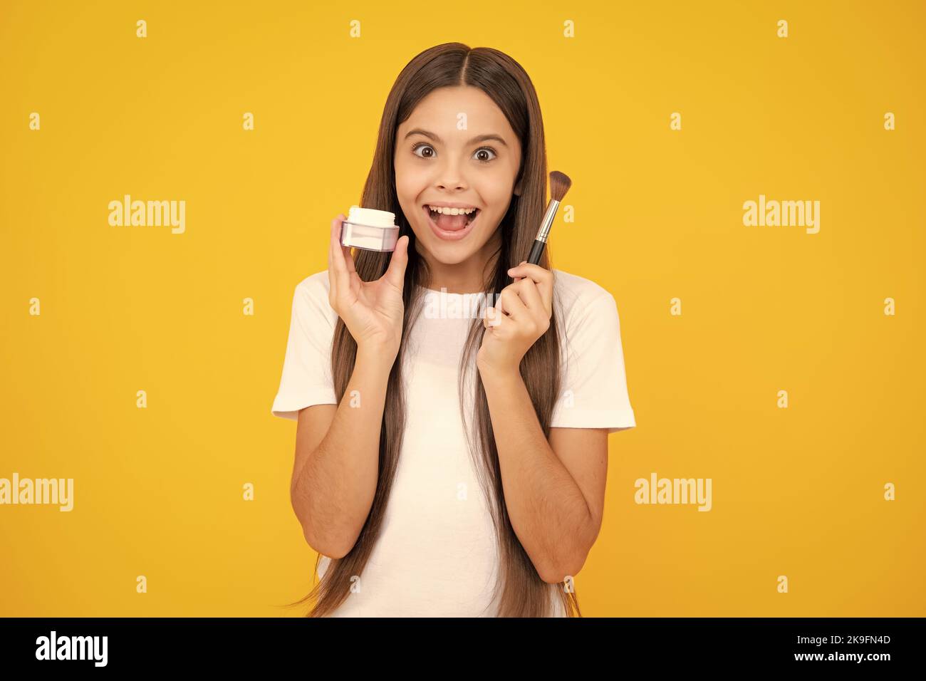 Child teen girl making beauty make up, hold powder and brush. Beautiful ...
