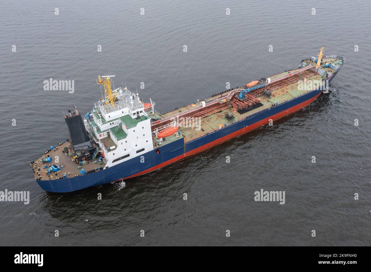 The sea tanker in the middle of a gulf Stock Photo - Alamy