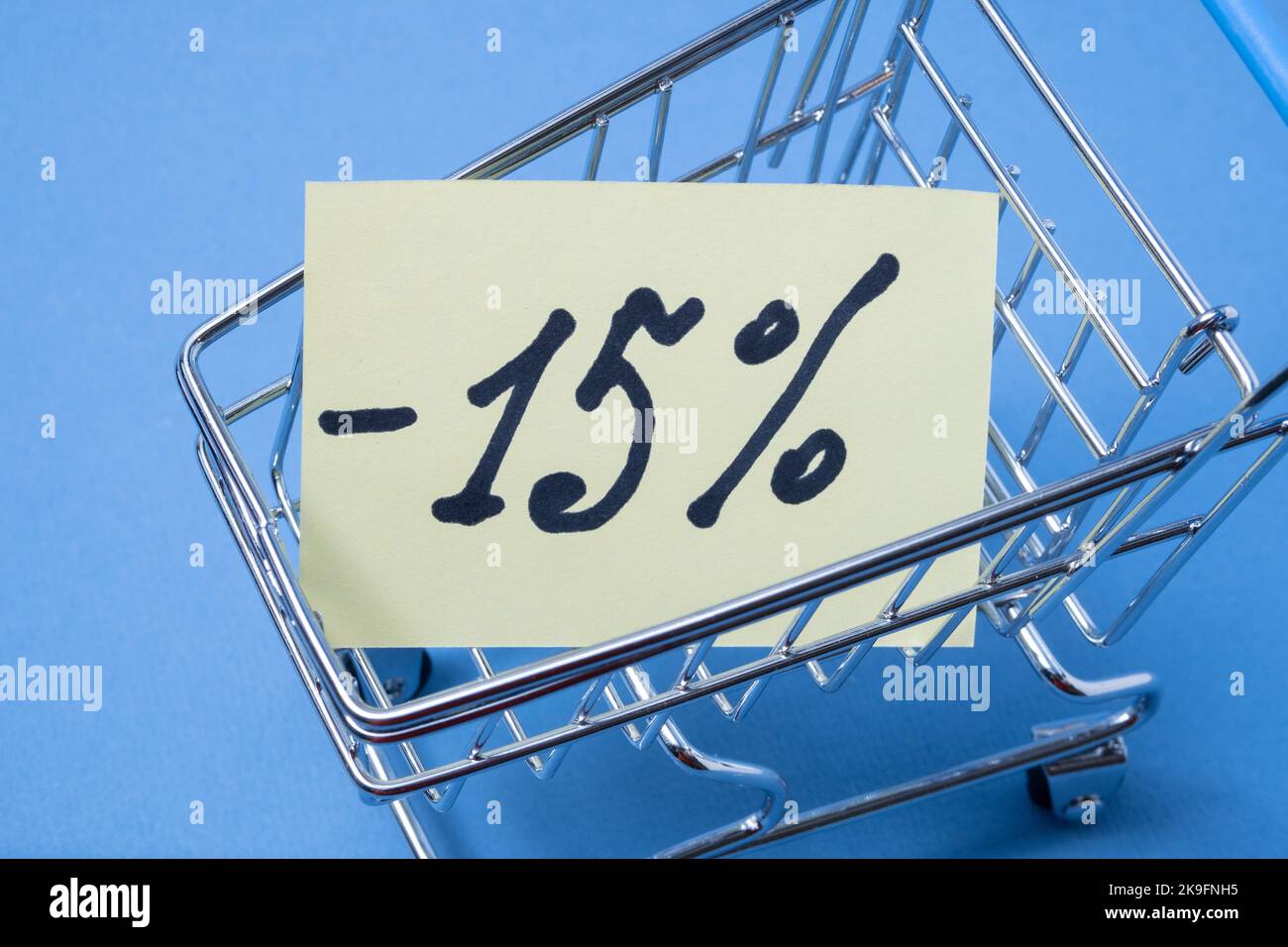 Shopping basket with a banner that says minus 15 percent Stock Photo ...