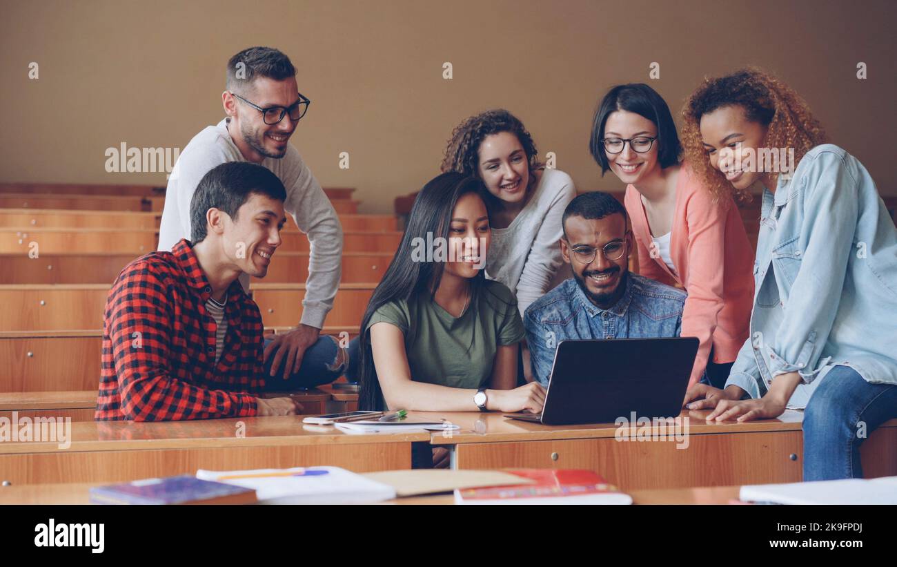 Group of students is taking part in video conference using laptop, they ...