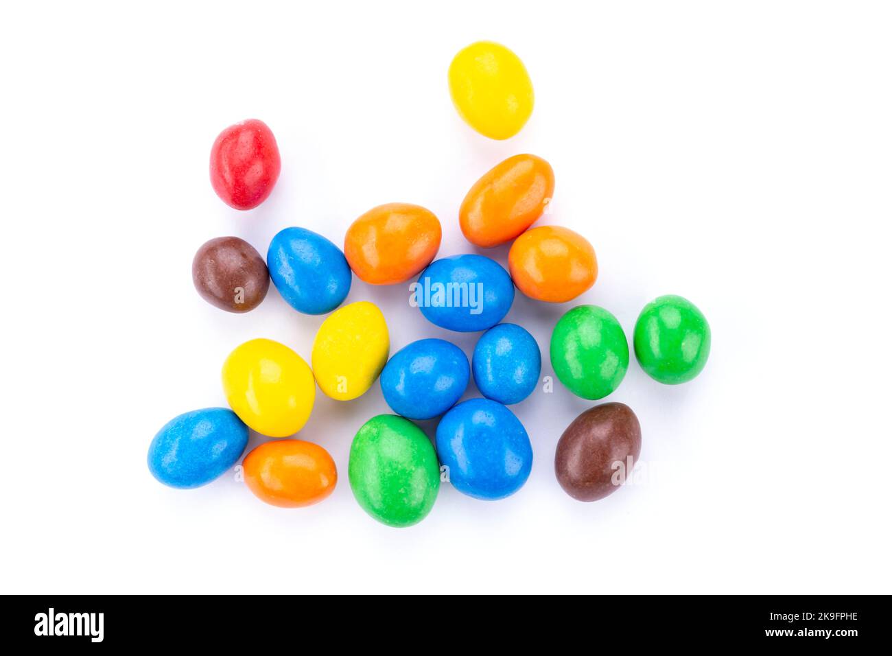 Colorful chocolate buttons, on white background. Chocolate coated ...