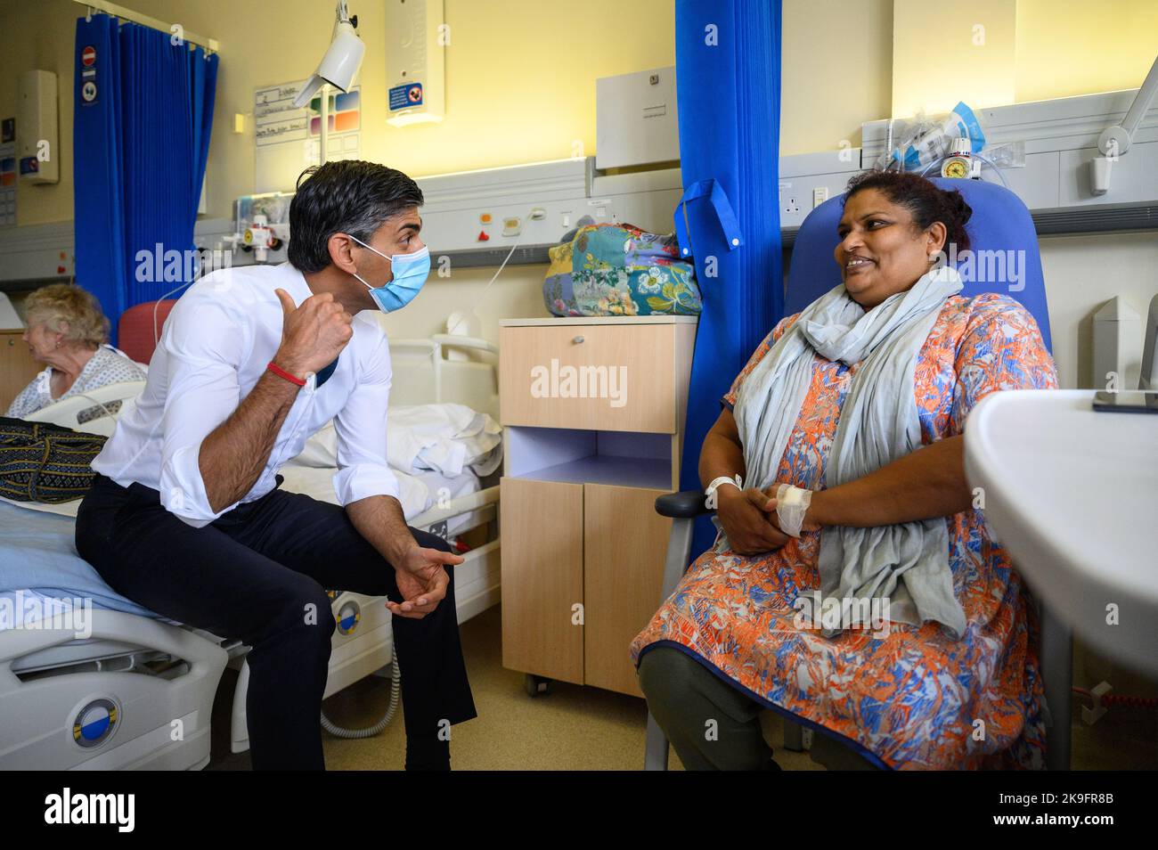 Prime Minister Rishi Sunak speaks with patient Sreeja Gopalan during a ...