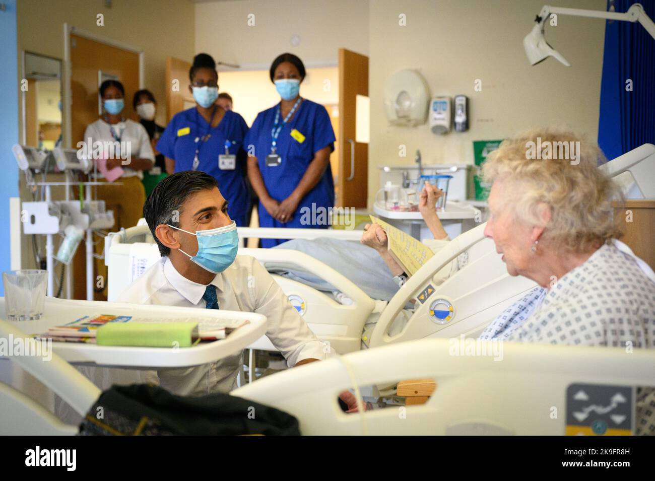 Prime Minister Rishi Sunak speaks with patient Catherine Poole during a ...