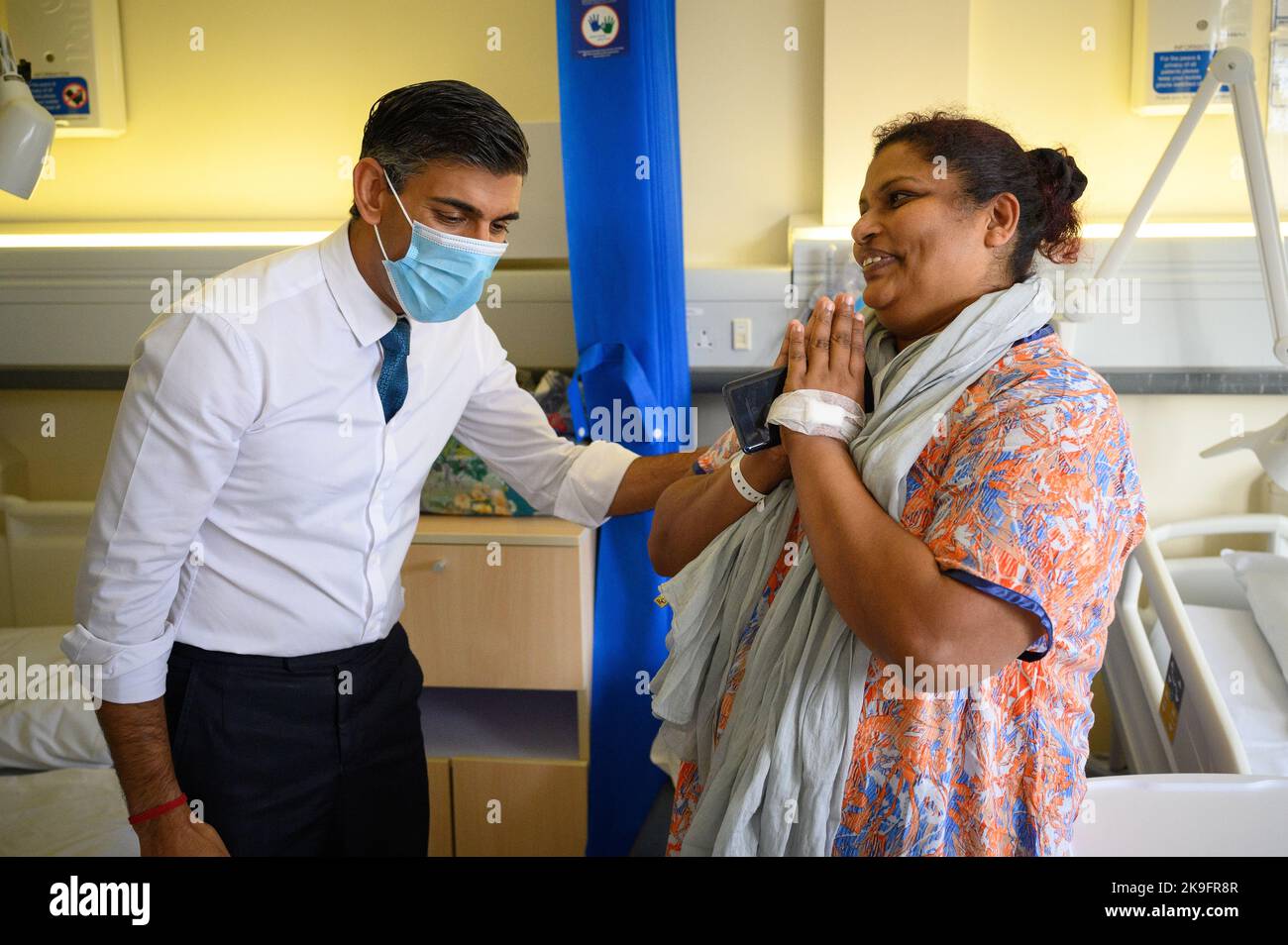 Prime Minister Rishi Sunak speaks with patient Sreeja Gopalan during a ...
