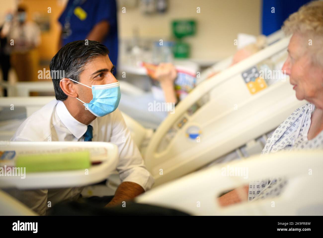Prime Minister Rishi Sunak speaks with patient Catherine Poole during a ...