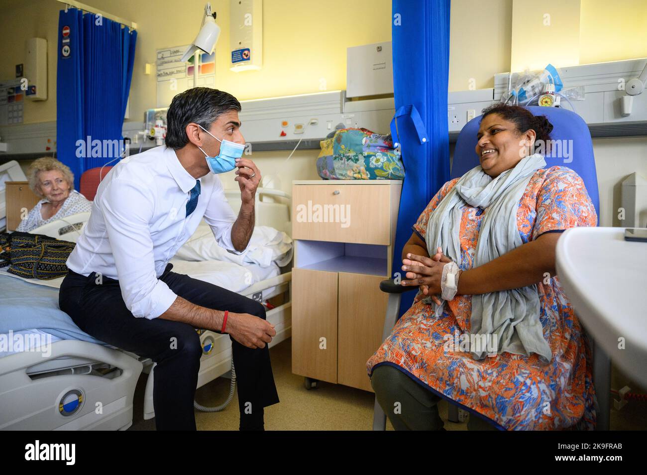 Prime Minister Rishi Sunak speaks with patient Sreeja Gopalan during a ...