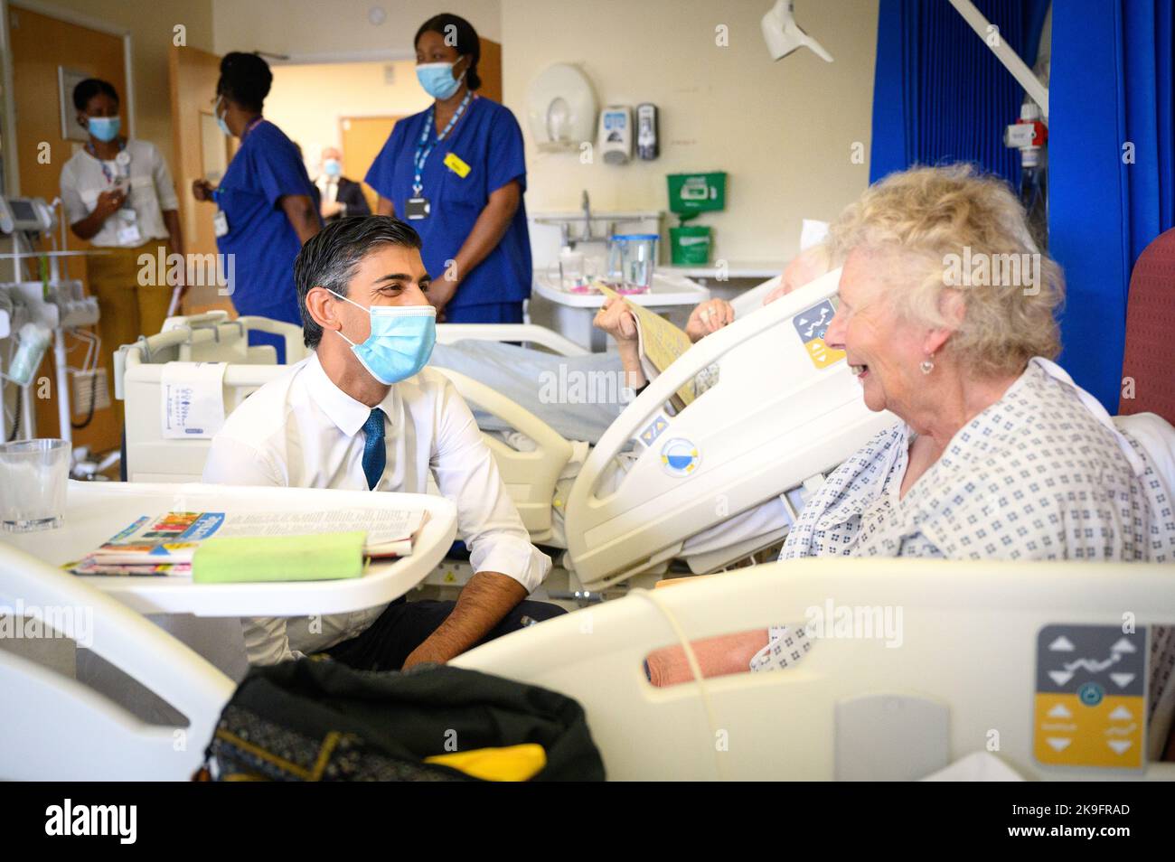 Prime Minister Rishi Sunak speaks with patient Catherine Poole during a ...