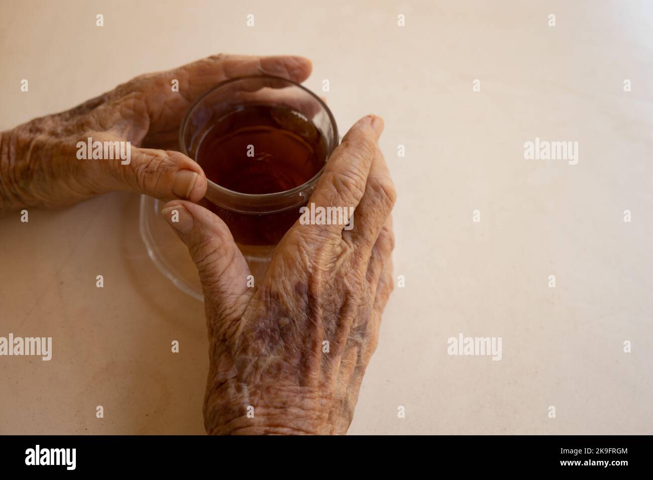Old lady holding tea cup hi-res stock photography and images - Alamy