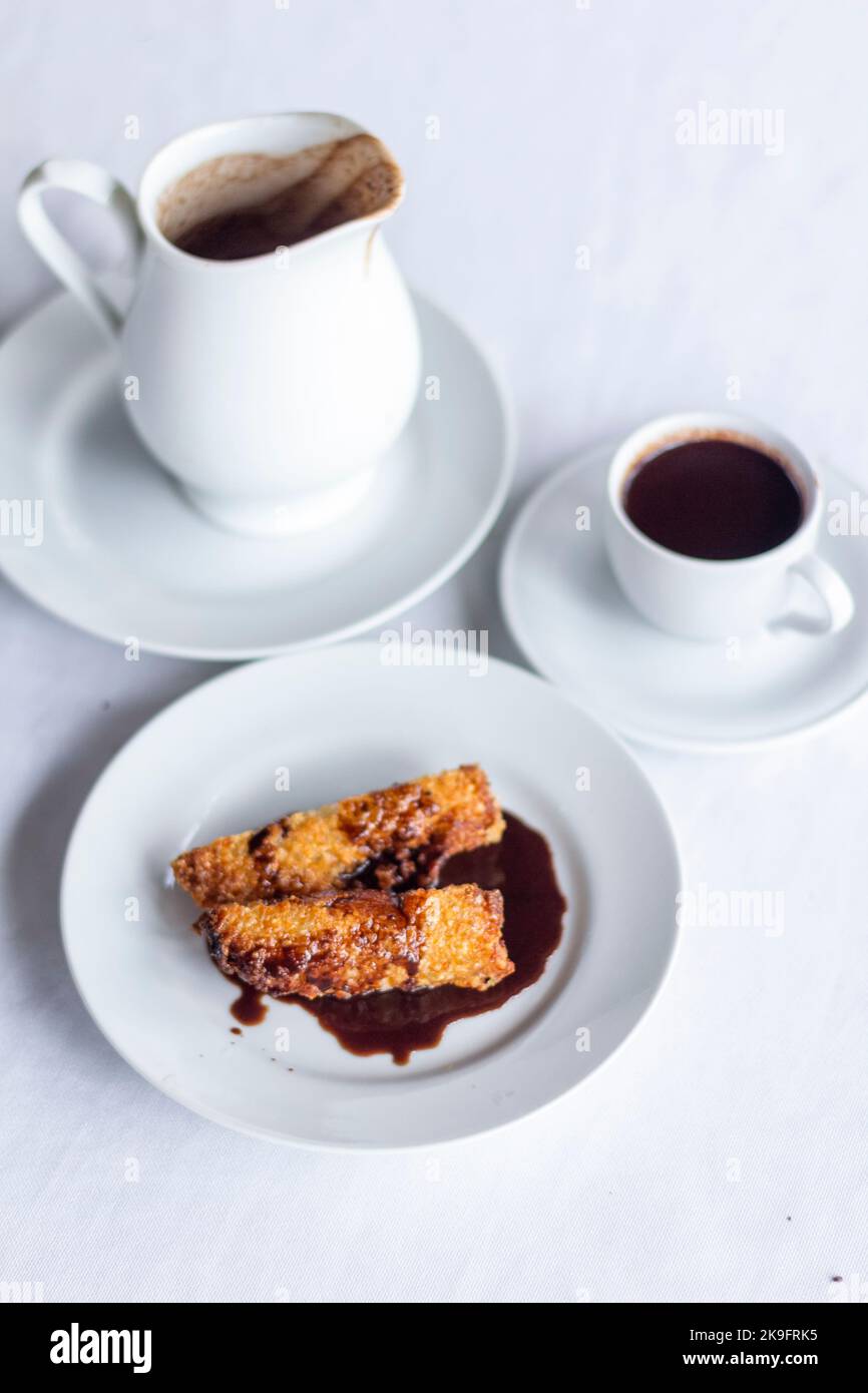 Fried rice cake with hot chocolate drink in Bicol, Philippines Stock ...
