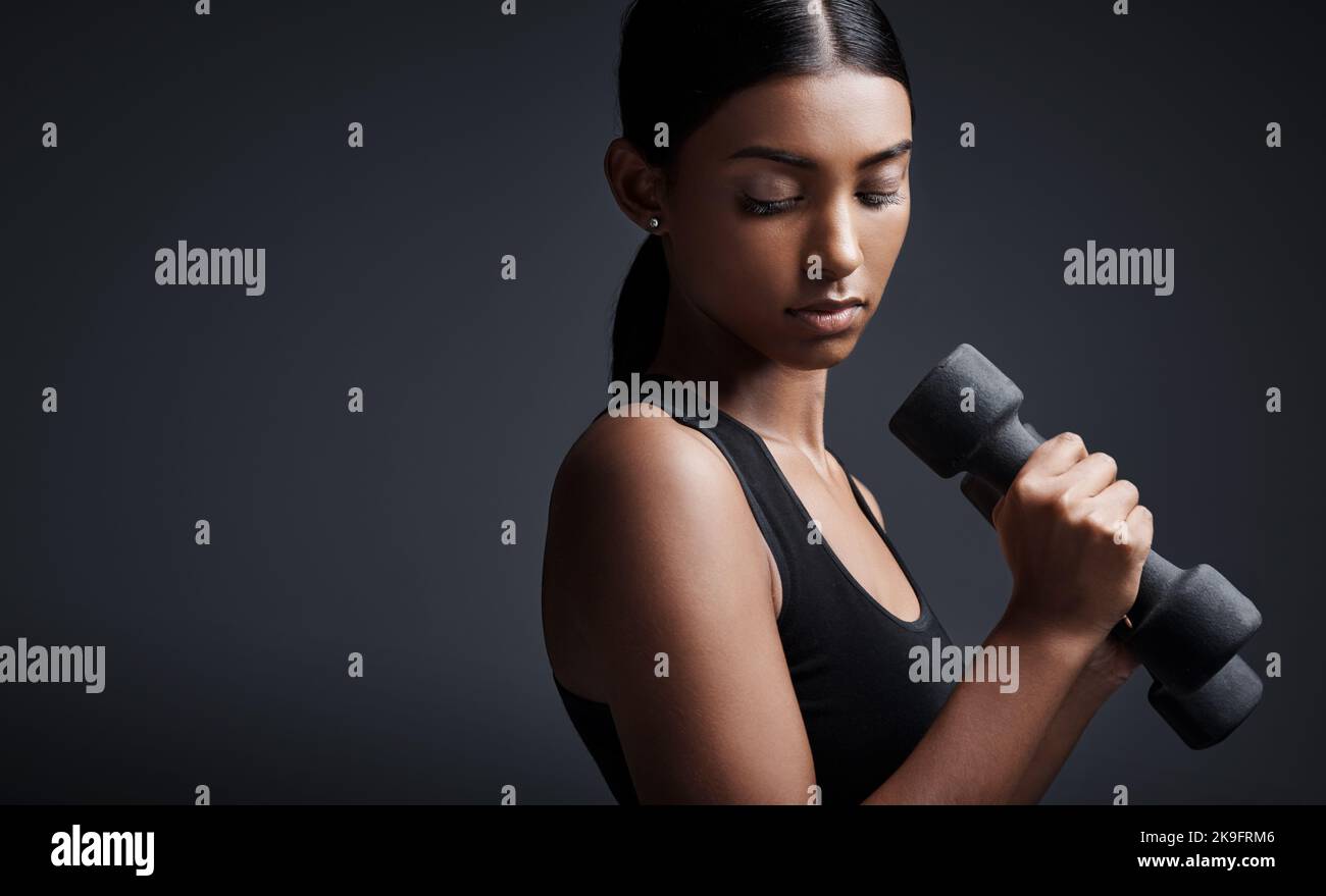Strive for progress not perfection. Studio shot of a young sportswoman ...