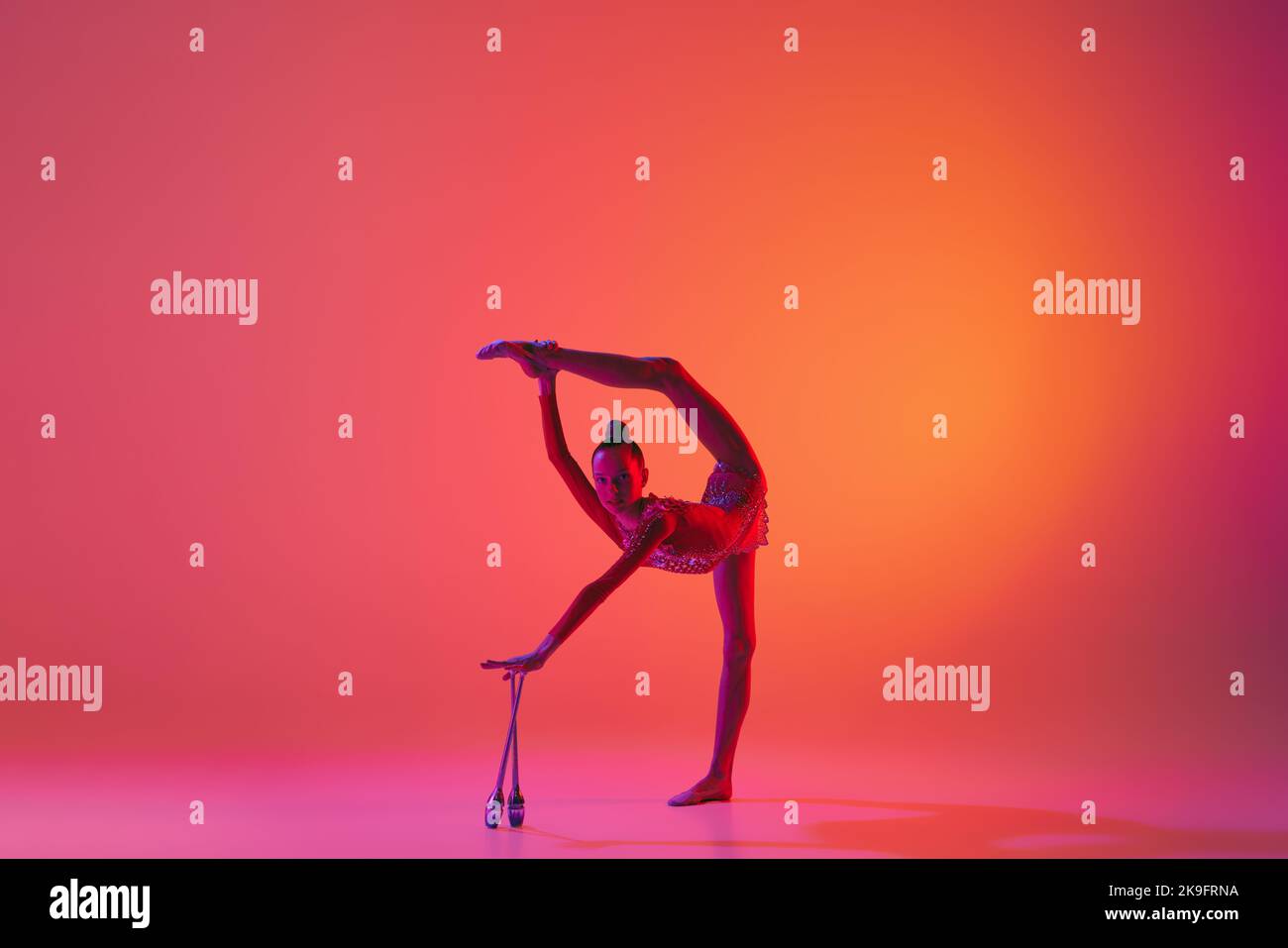 Emotions in motion. Portrait of junior female gymnast in black sport ...