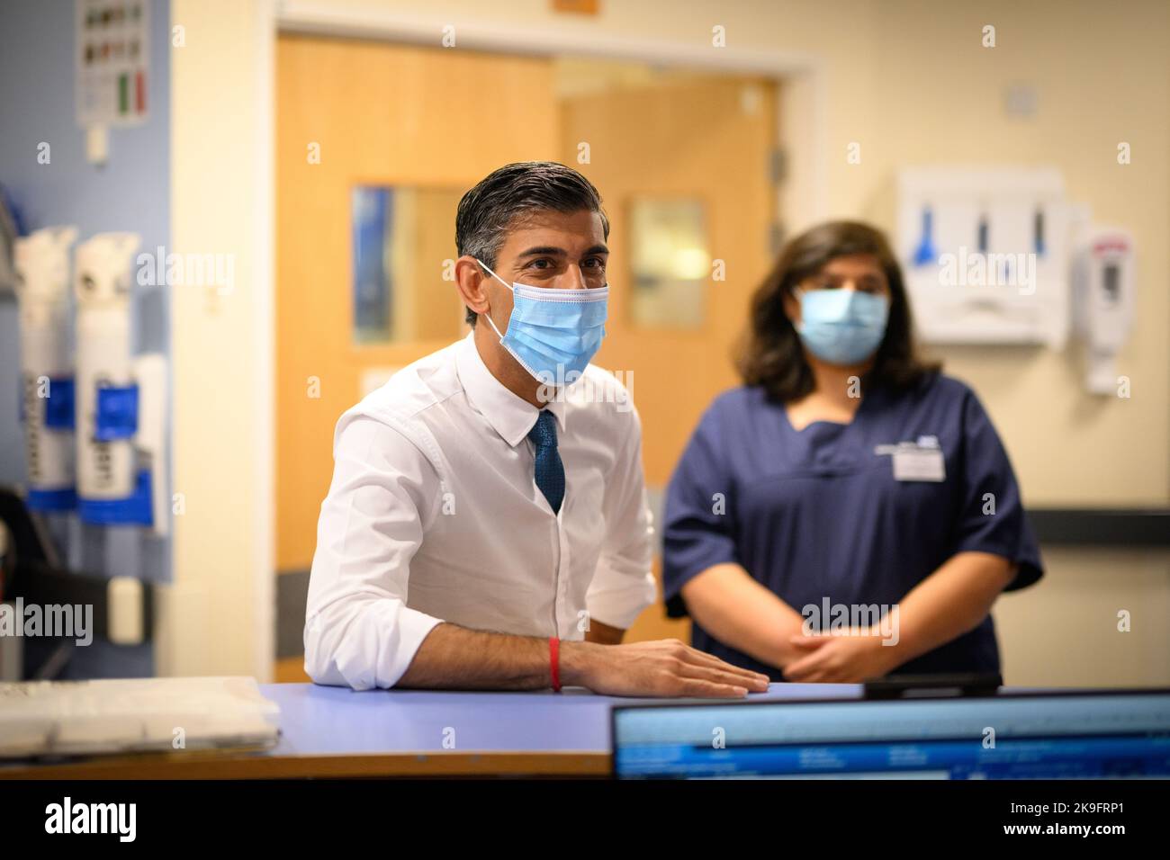 Prime Minister Rishi Sunak speaks with members of staff during a visit ...